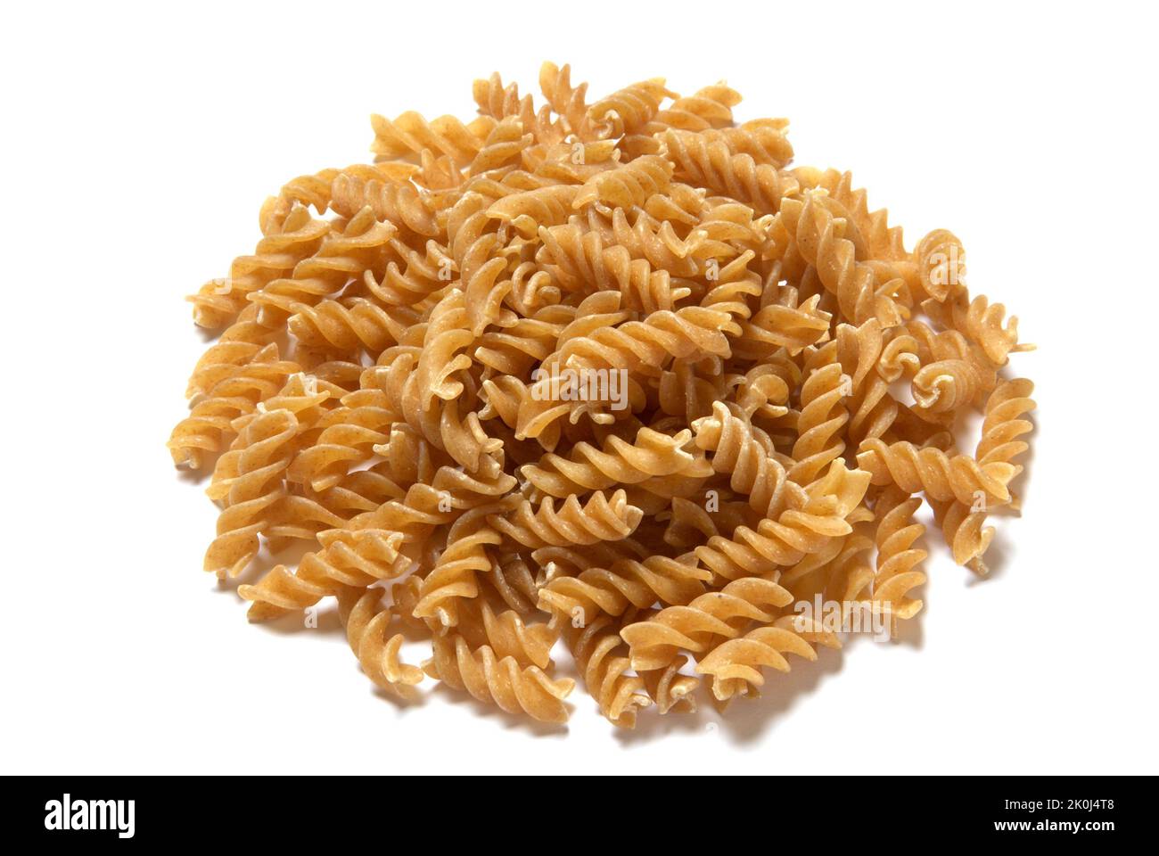 A pile of raw wholewheat fusilli pasta shapes on white Stock Photo - Alamy