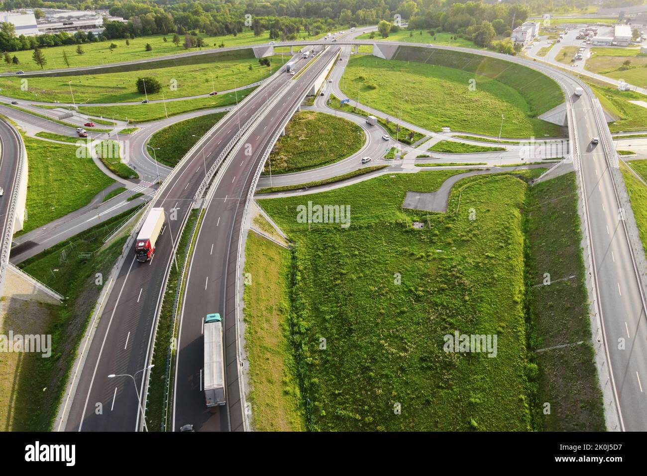Aerial view of cars driving on round intersection in city ...