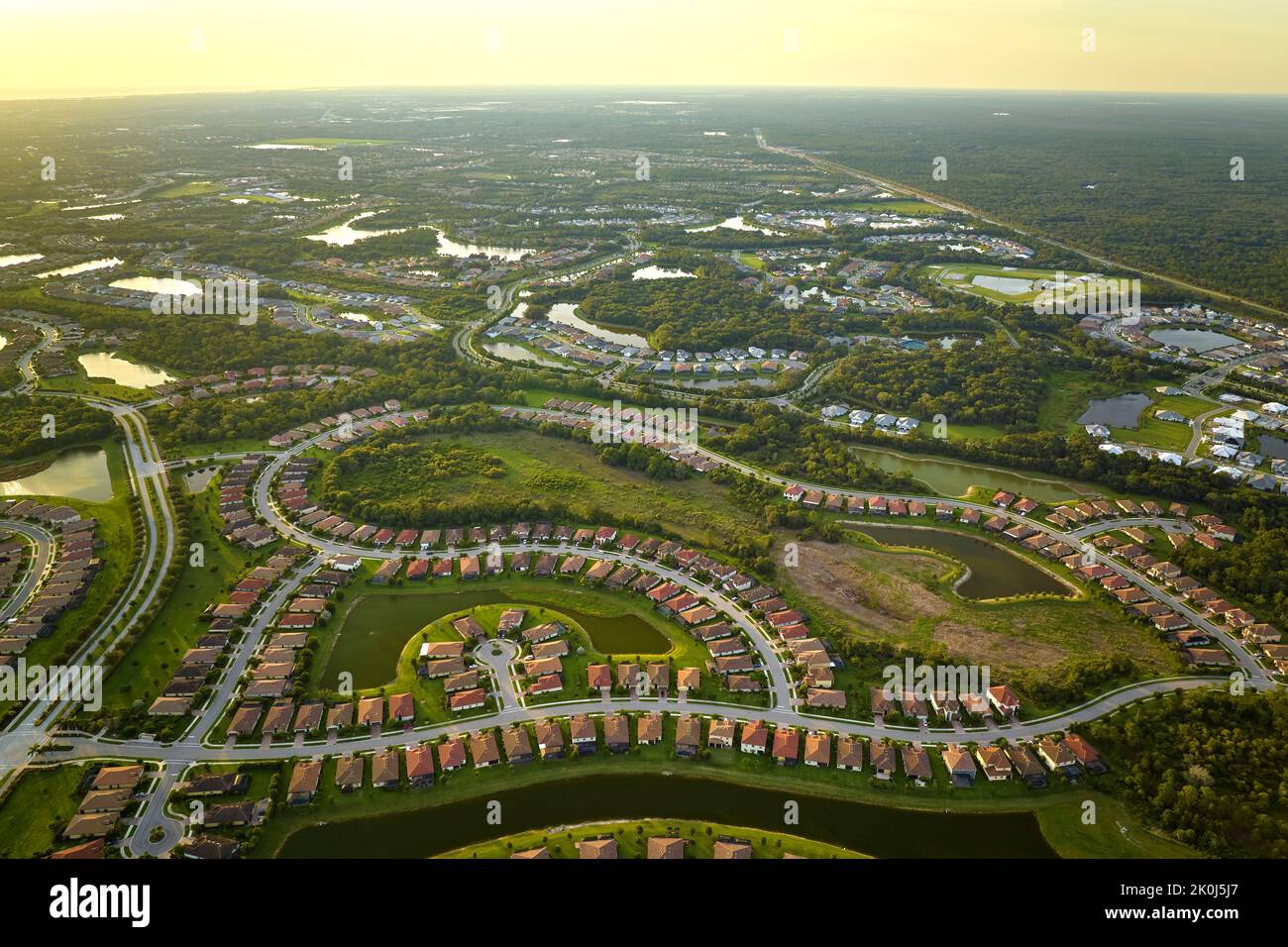 Aerial view of tightly located family houses in Florida closed suburban ...