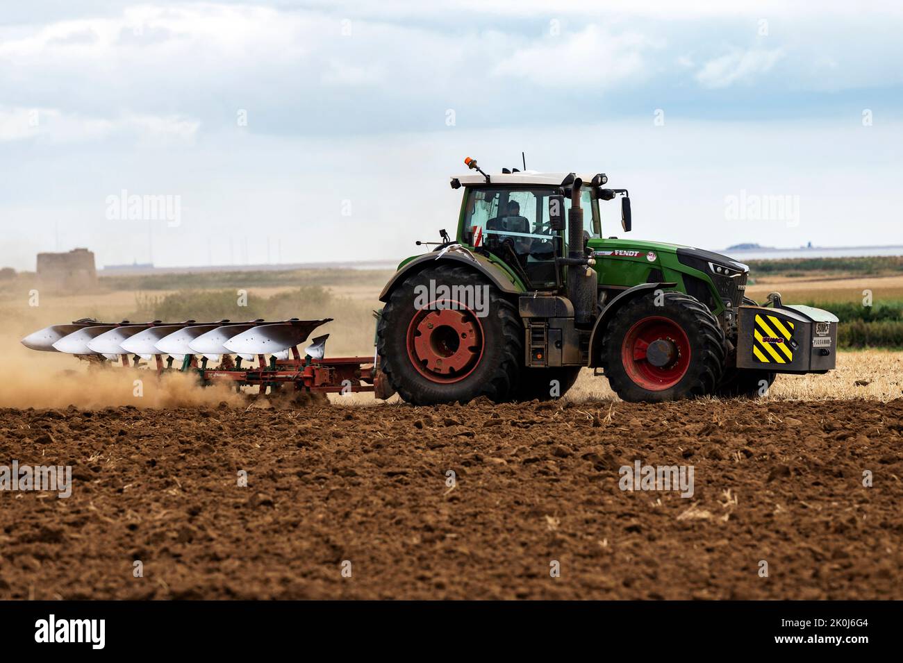 Fendt 442 Vario tractor with plough Bawdsey Suffolk UK Stock Photo - Alamy