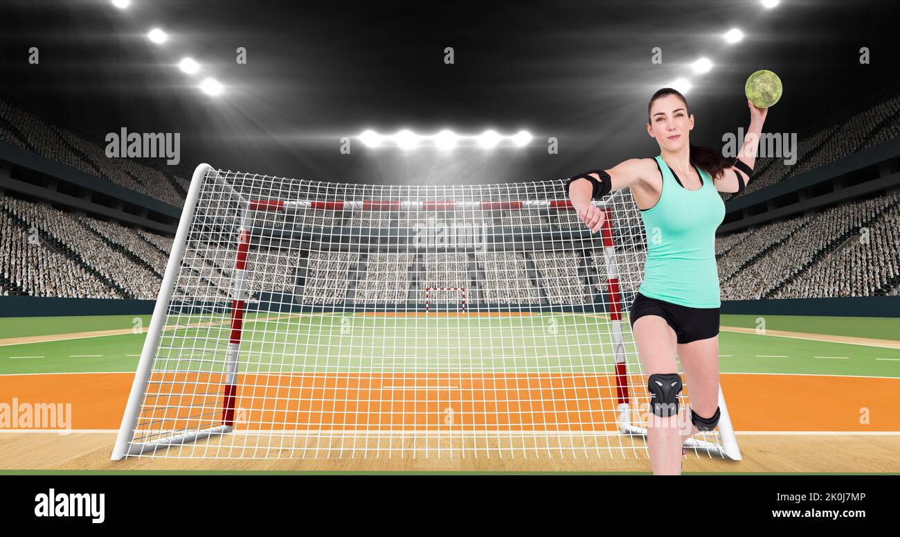 Focused caucasian female player throwing handball while playing at ...