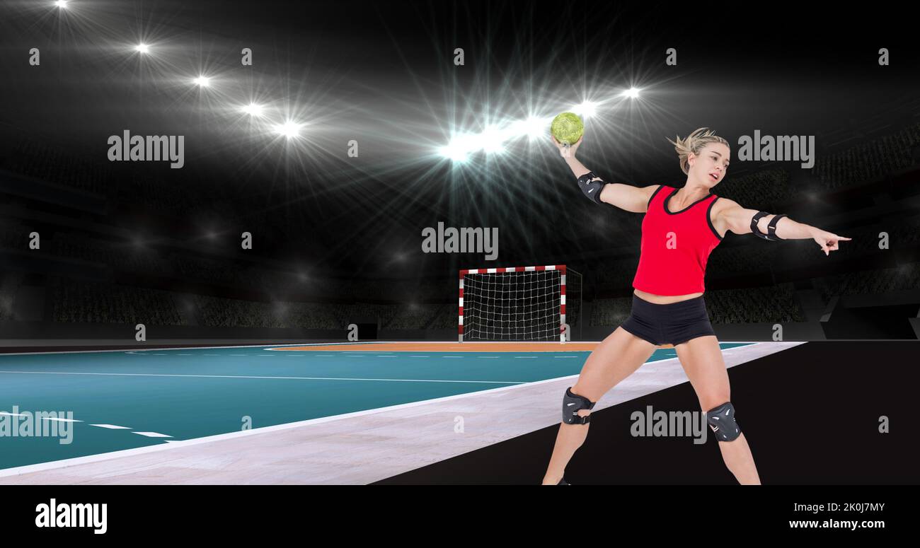 Focused caucasian female handball player pointing while throwing ball ...