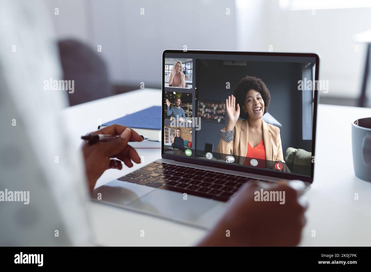 Hands of african american woman having laptop video call with diverse ...