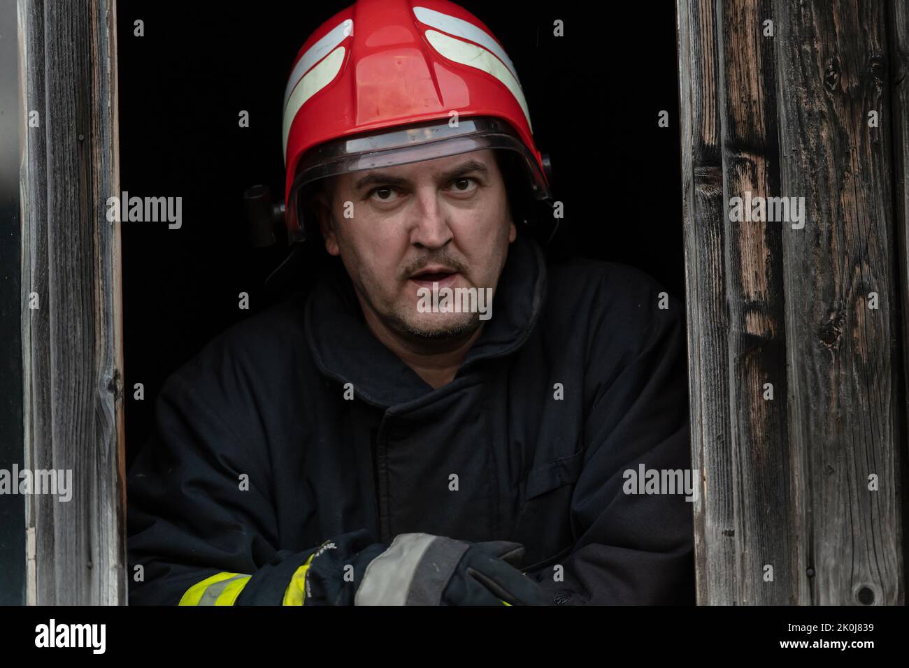 Firefighter hero carrying baby girl out from burning building area from ...
