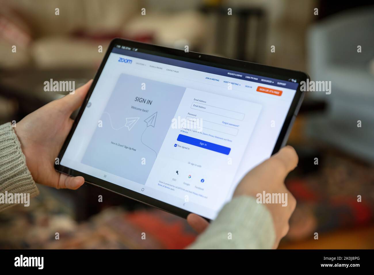 Greece, Athens, January 23 2022. Zoom Sign in page. Conference networking app on Tablet screen ...