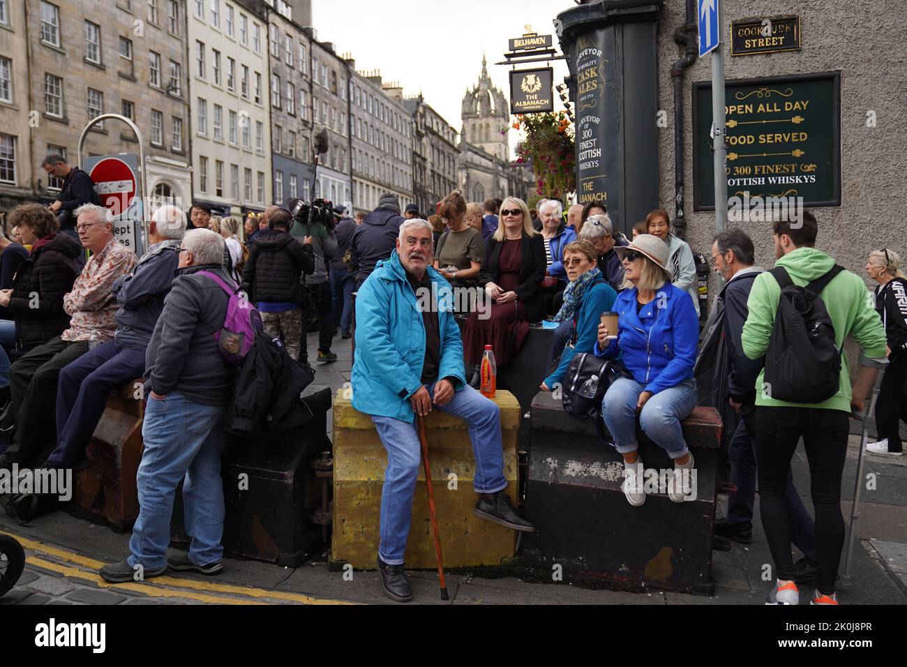 People gather on the Royal Mile in Edinburgh ahead of the procession of ...