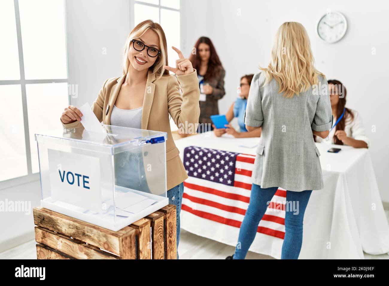 Group of young girls voting at democracy referendum smiling and ...