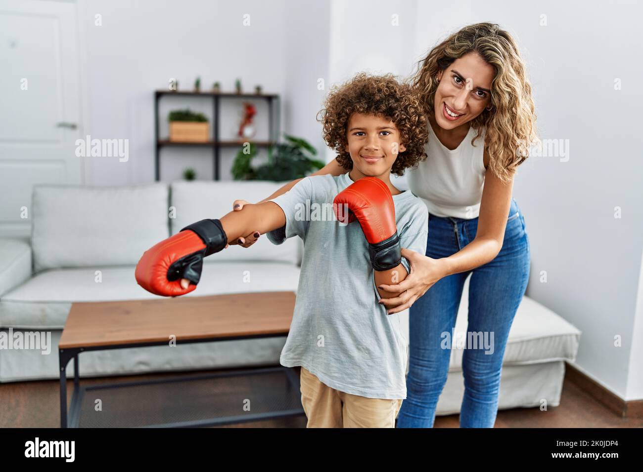 Mother and son smiling confident boxing at home Stock Photo - Alamy