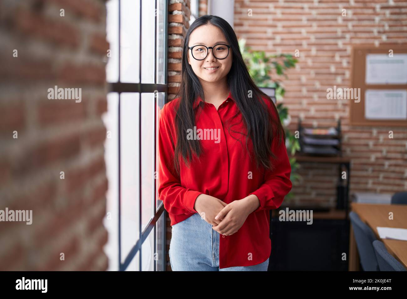 Young chinese woman business worker smiling confident at office Stock ...
