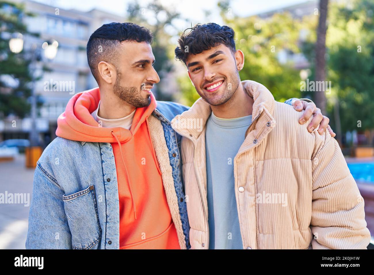 Two man couple hugging each other standing at park Stock Photo - Alamy