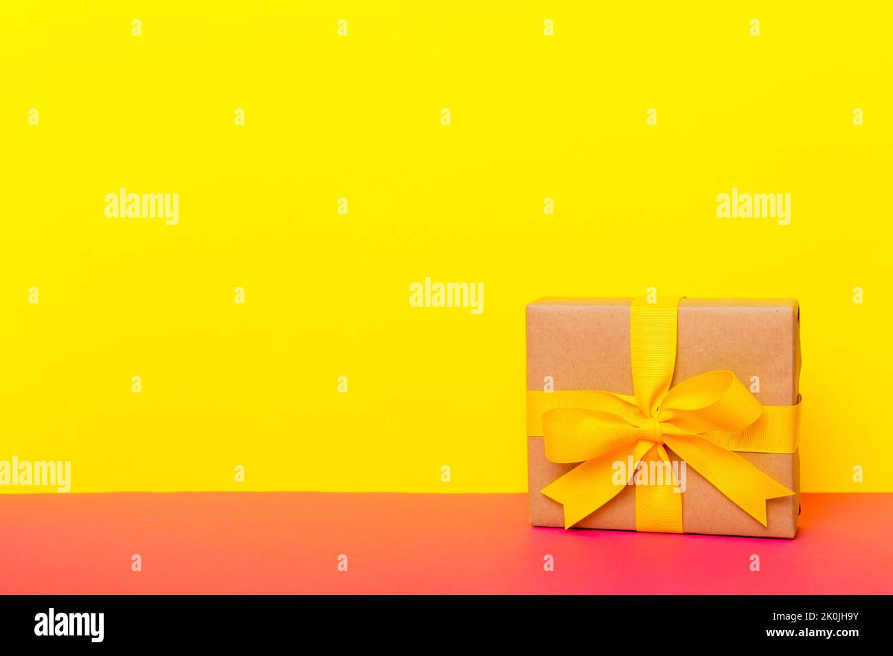 holiday paper present tied yellow ribbon bow top view with copy space ...
