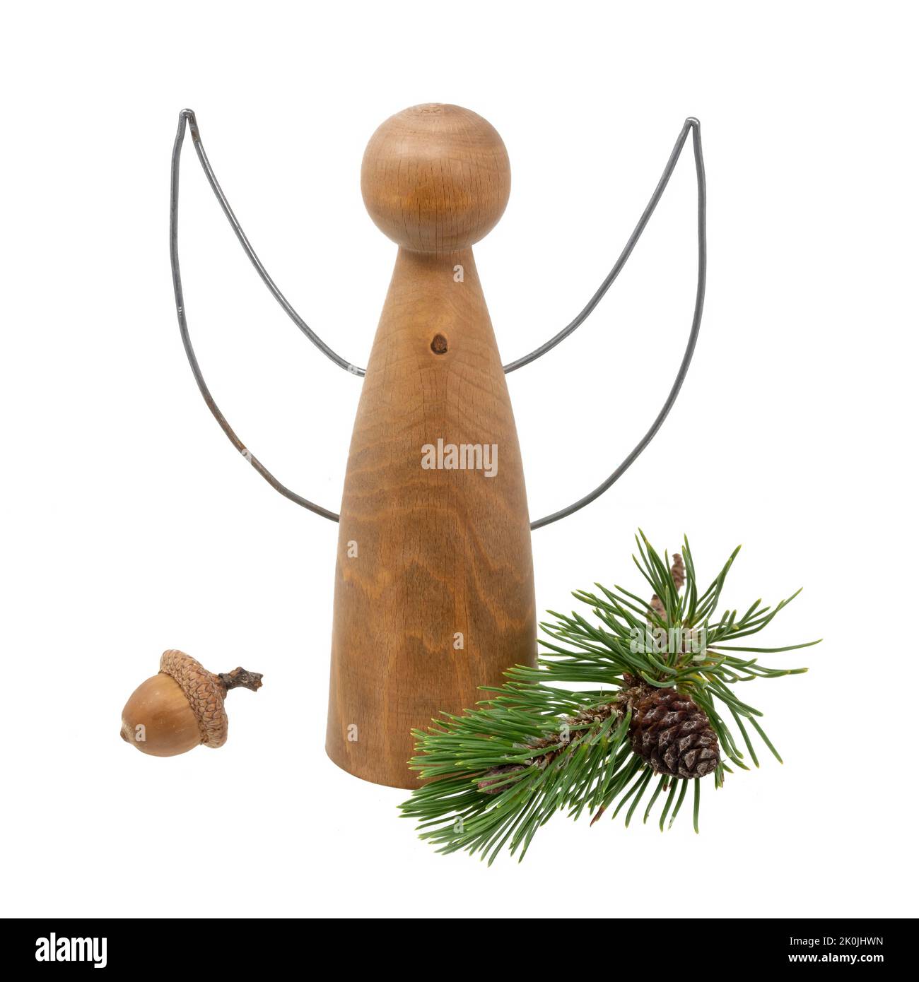 Turned wooden angel figure decorated with pine cones and pine needles ...