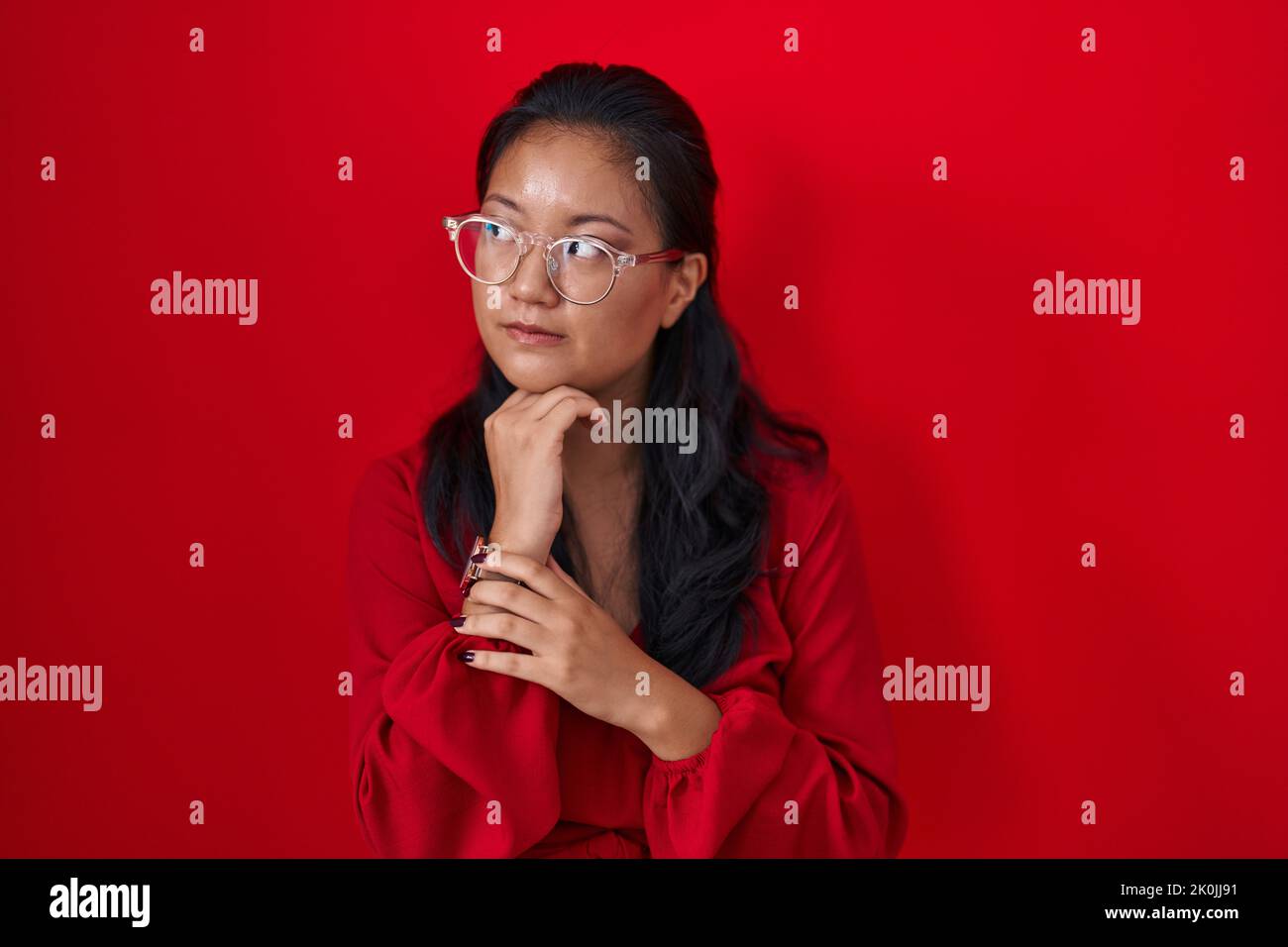 Happy young asian woman giggling hi-res stock photography and images ...
