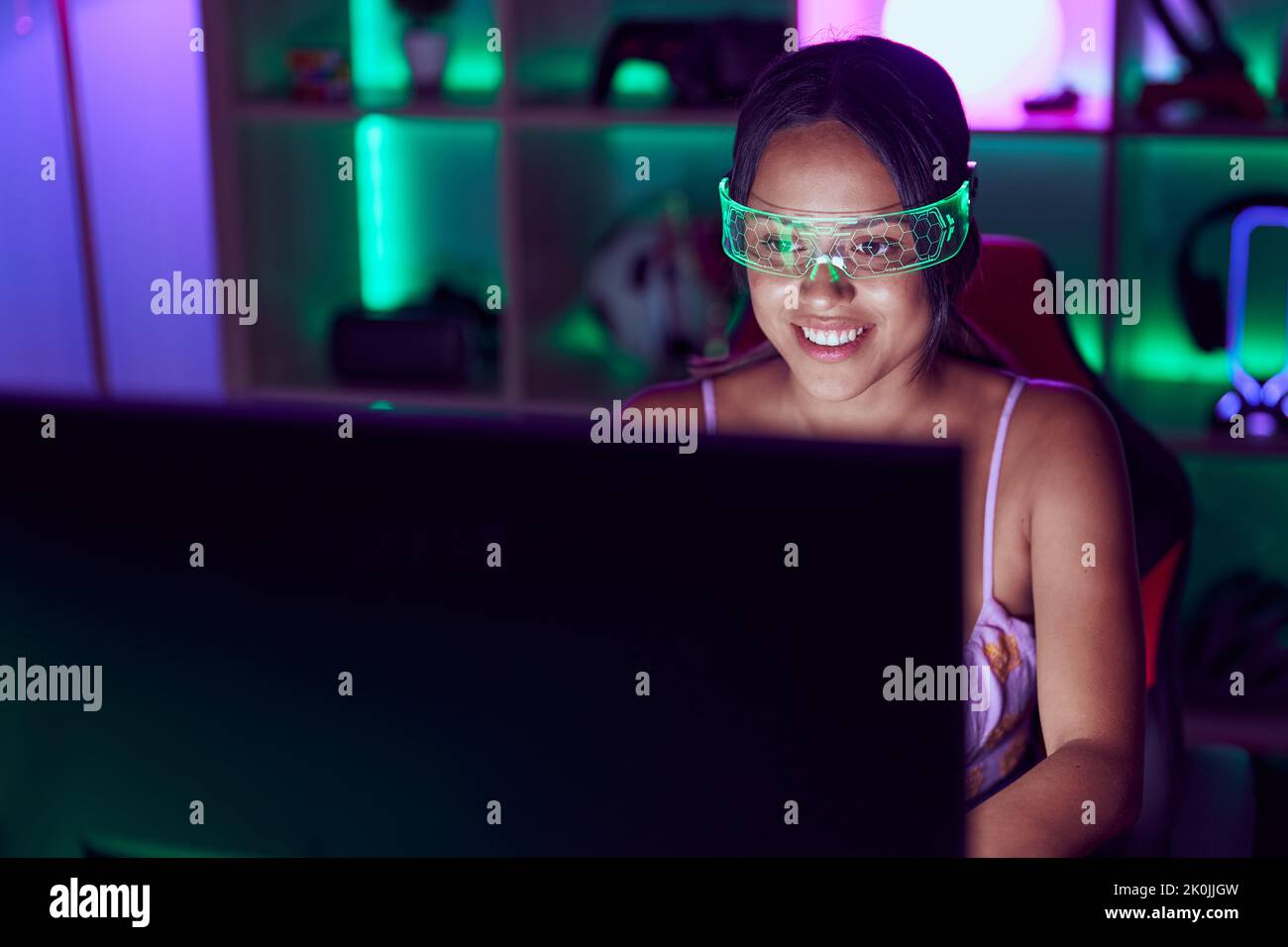 Young hispanic woman streamer using computer and virtual reality ...