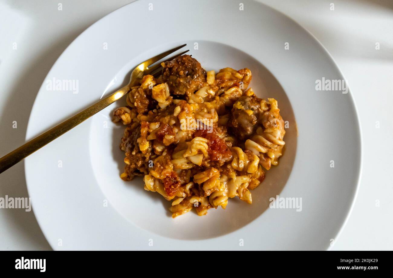 Rotini pasta and meatballs in a ragu Stock Photo - Alamy