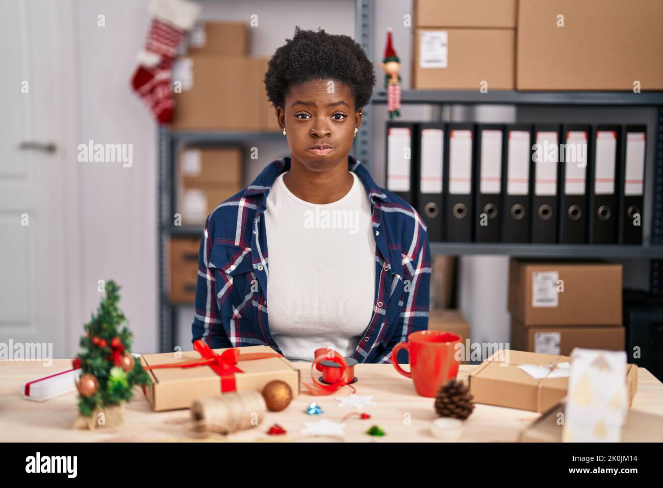 African american woman working at small business doing christmas ...