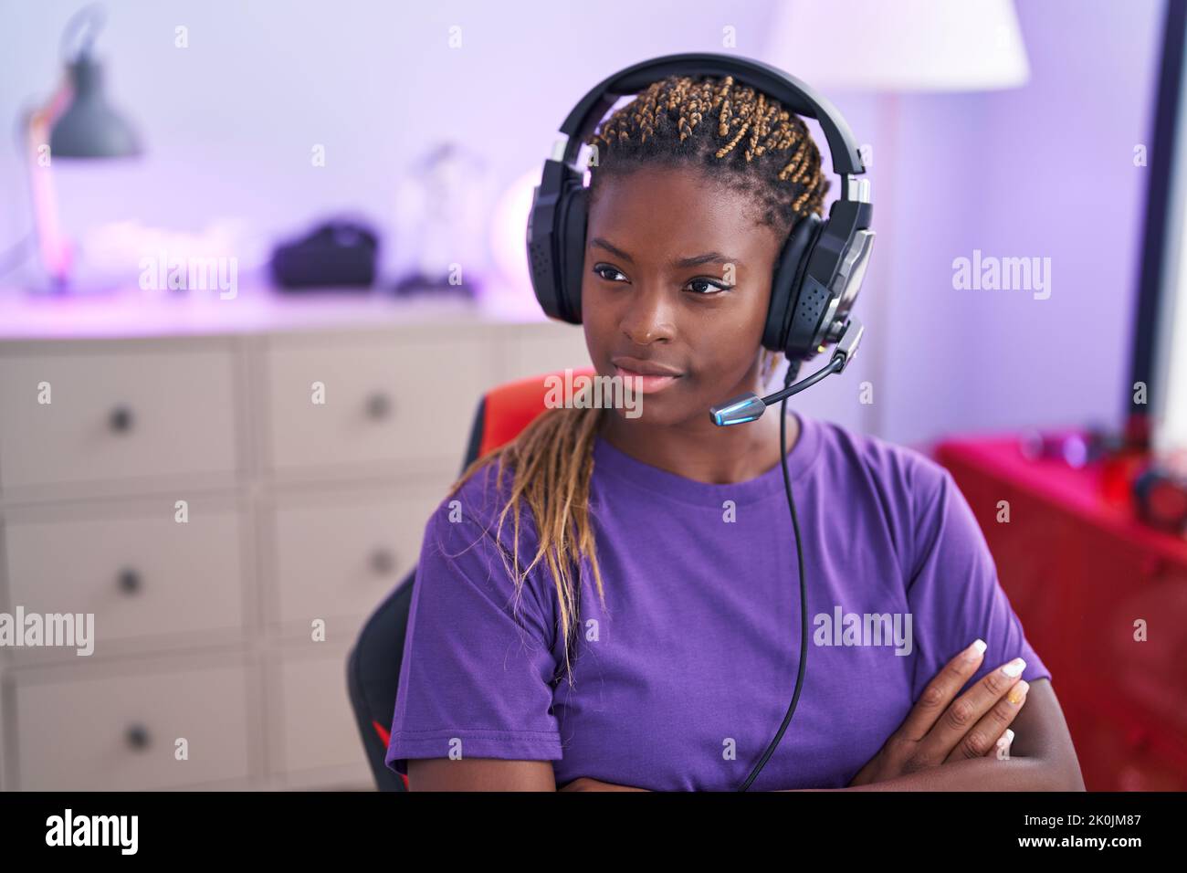 African american woman streamer sitting with arms crossed gesture at ...