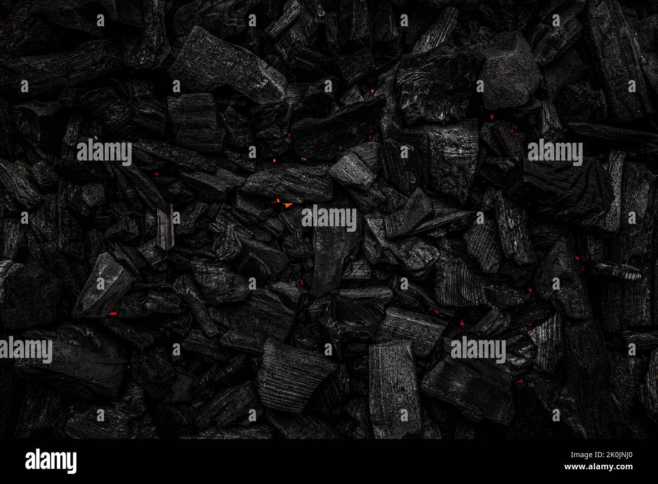 Charcoal with red streaks of heat. Textured dark background Stock Photo ...