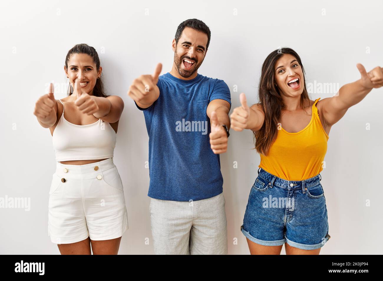 Group of young hispanic people standing over isolated background ...