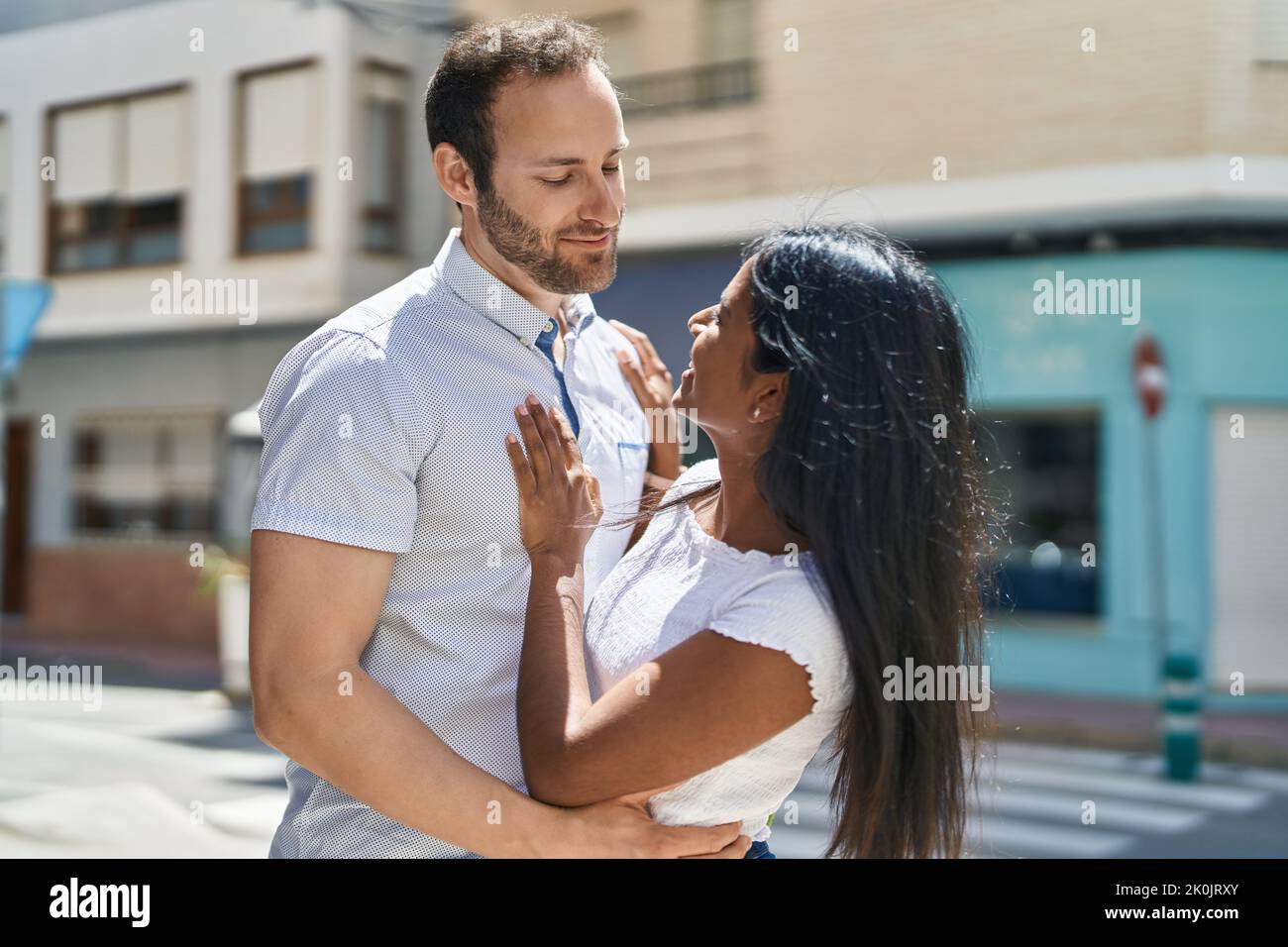 Man And Woman Interracial Couple Hugging Each Other At Street Stock