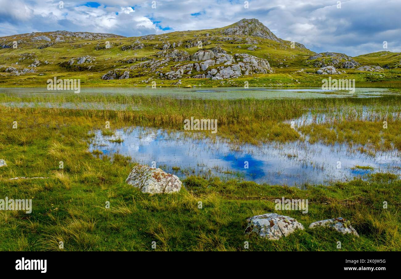 Ben Hogh (106 metres) is the highest hill on Coll with Loch Ballyhaugh ...