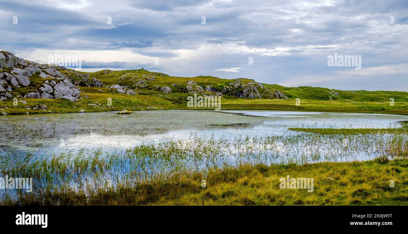Ben Hogh (106 metres) is the highest hill on Coll with Loch Ballyhaugh ...