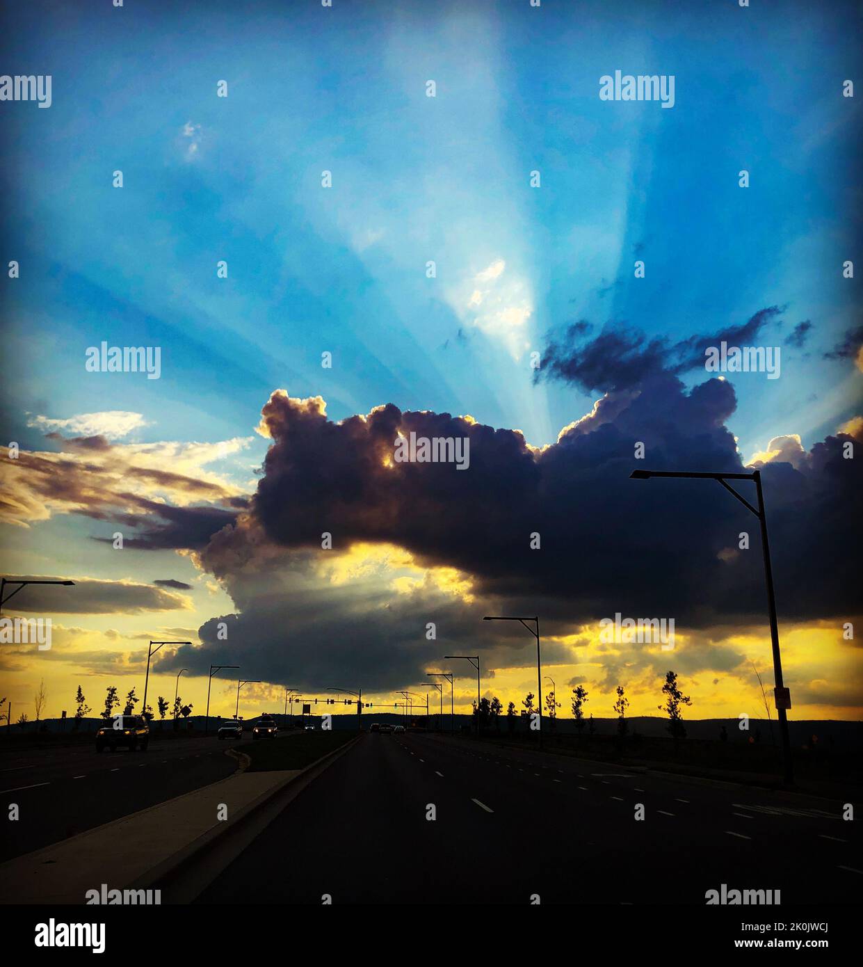 sun shining through storm clouds in a Maryland sky Stock Photo - Alamy