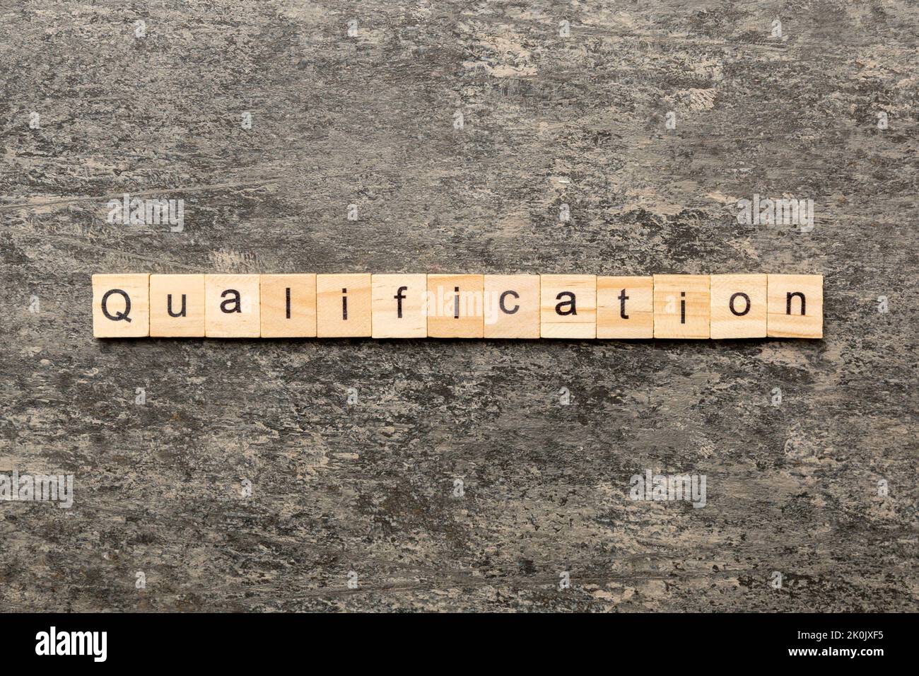 qualification word written on wood block. qualification text on table ...