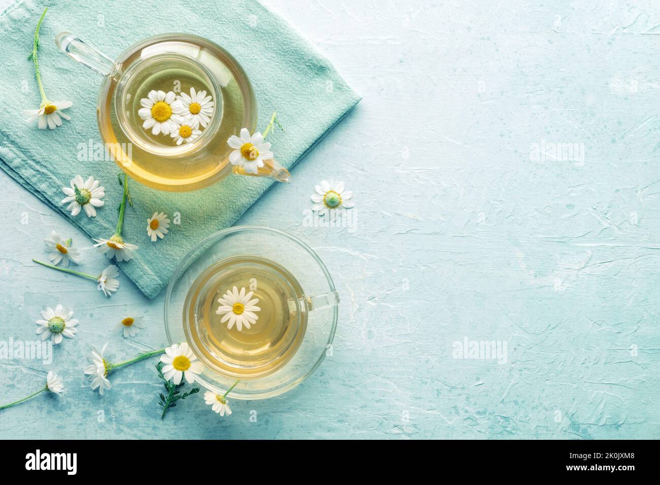 Chamomile tea. Camomile infusion in a cup with a tea pot, natural ...