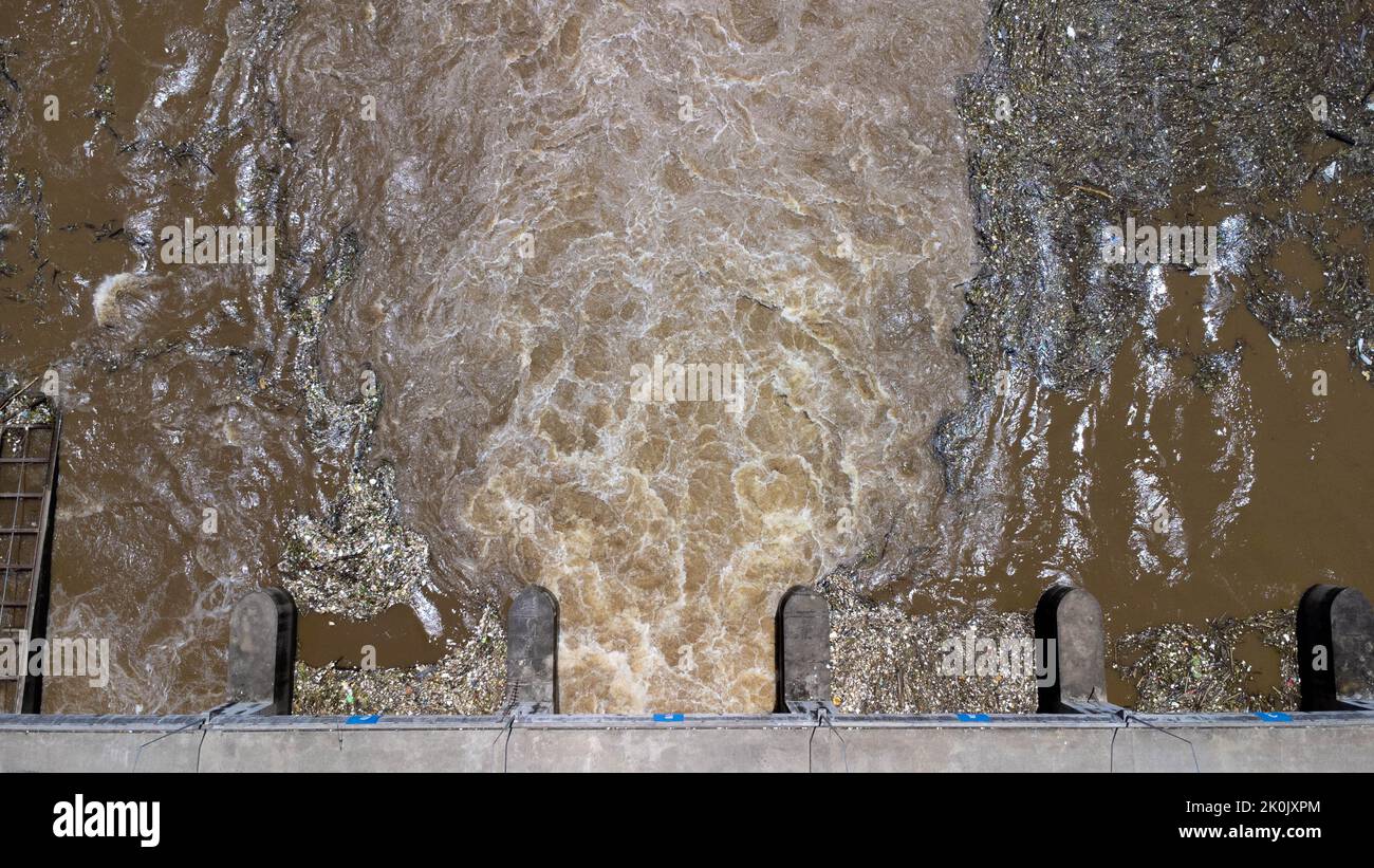 Aerial view of the water released from the concrete dam's drainage ...