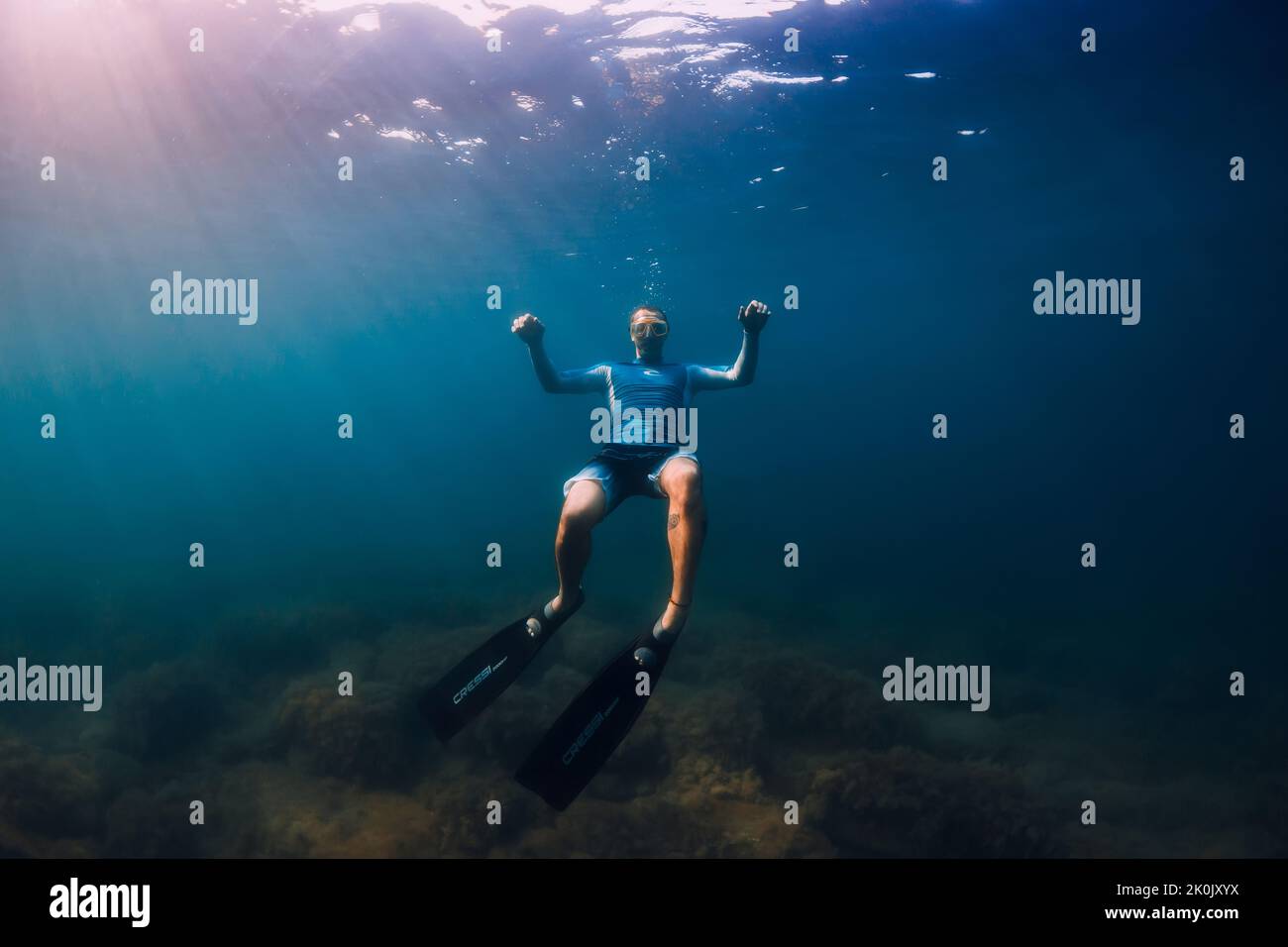 August 07, 2021. Varna, Bulgaria. Men freediver with fins on deep in ...