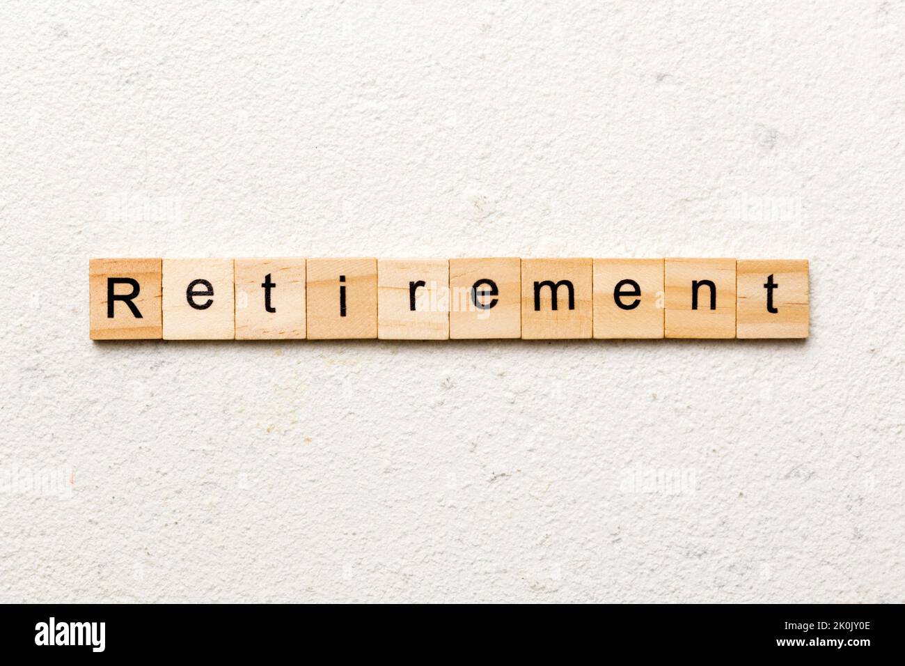 retirement word written on wood block. retirement text on cement table ...