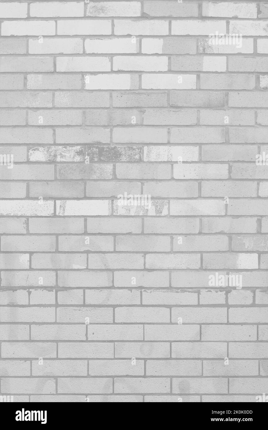 Typical common weathered brick wall in a faded black and white ...
