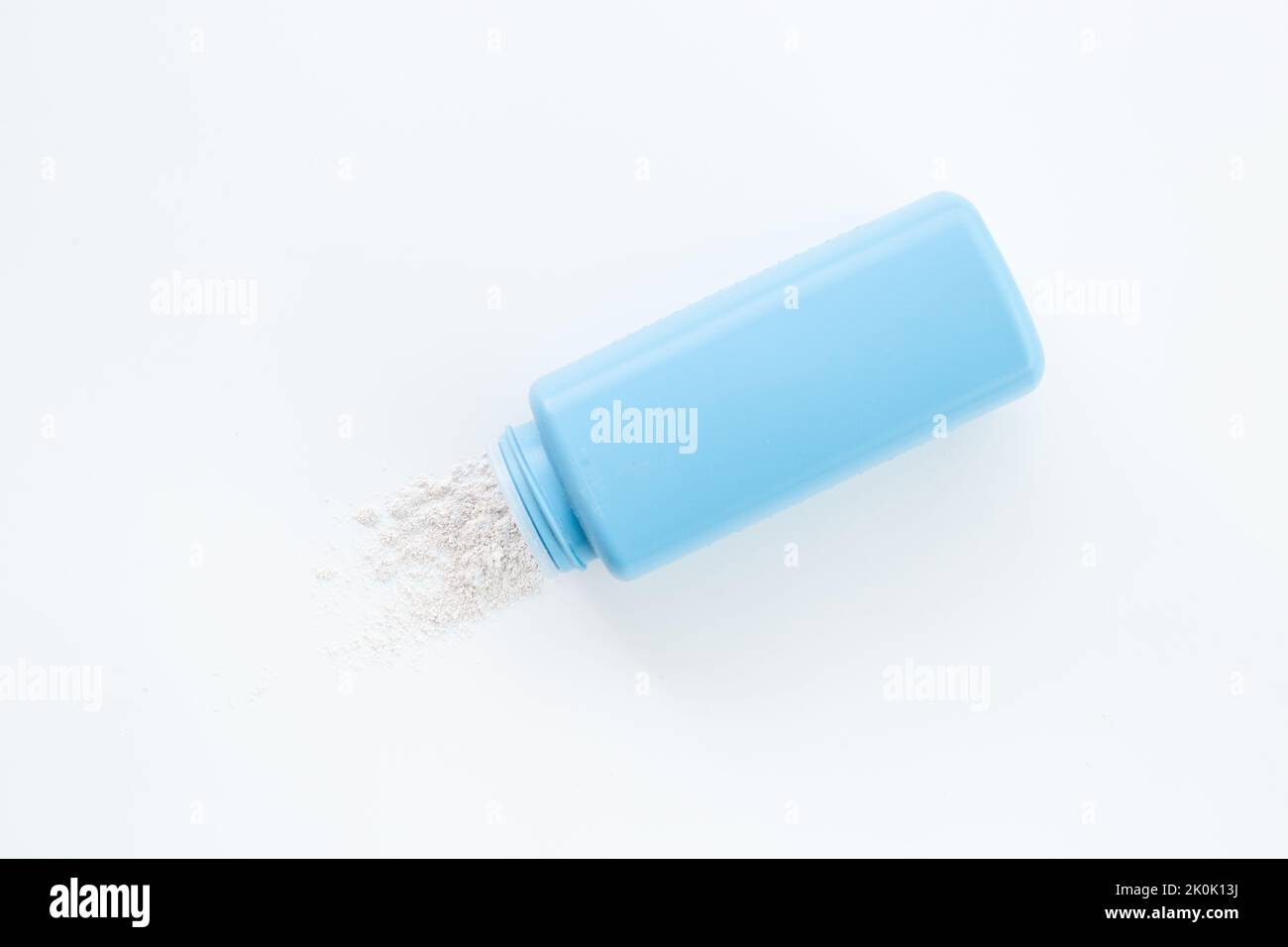 Talcum powder in container. Spilled white powder Stock Photo - Alamy