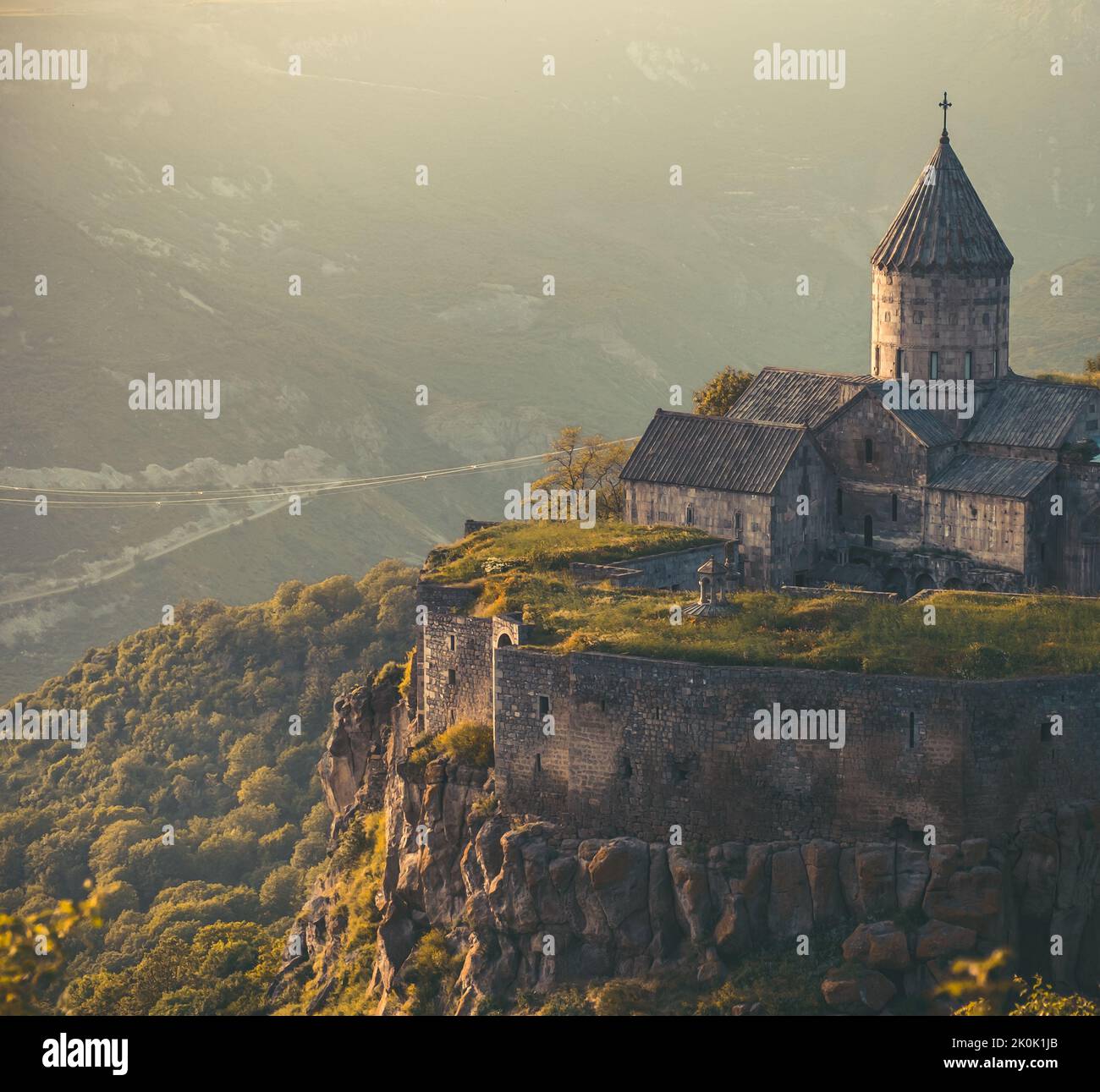 Old vintage monastry, mountain hill in sunset. Tatev ancient monastery ...