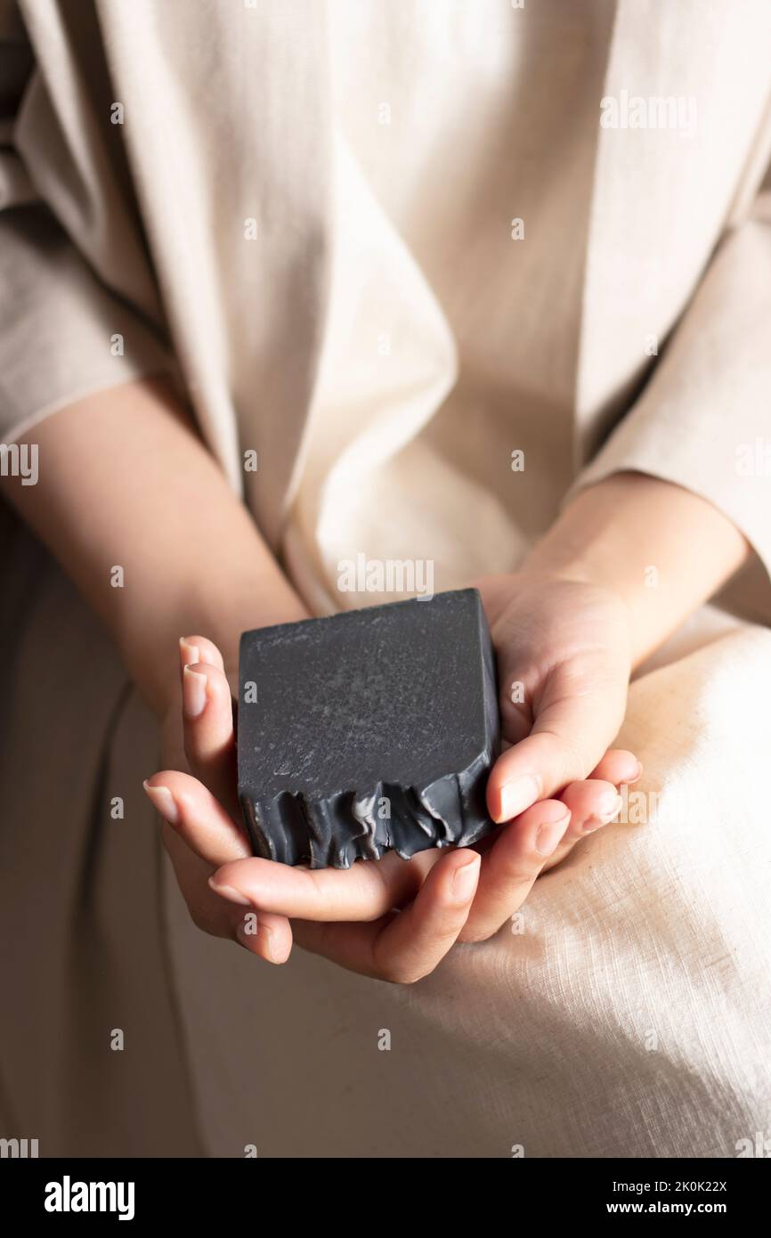 Advertising photography of natural handmade soap , which is held by a ...
