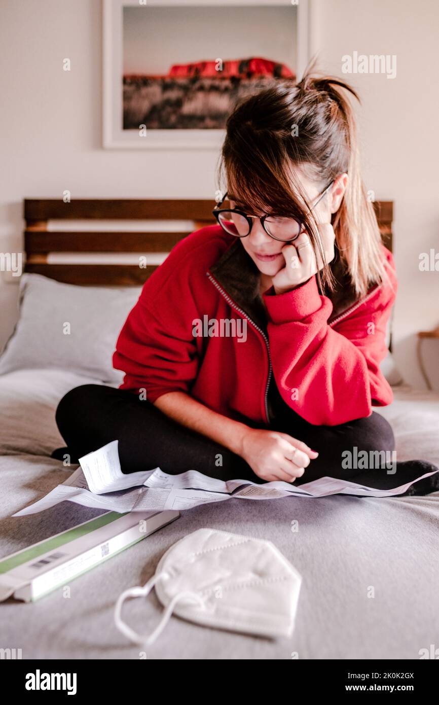 Full body of concentrated female reading instruction leaflet of rapid ...