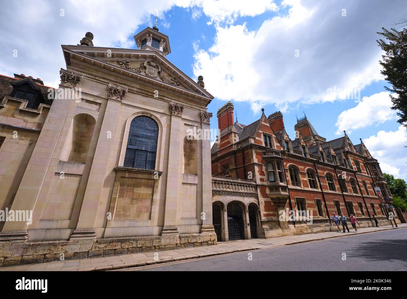 Typical stone and red brick old architecture along a quiet street. In ...