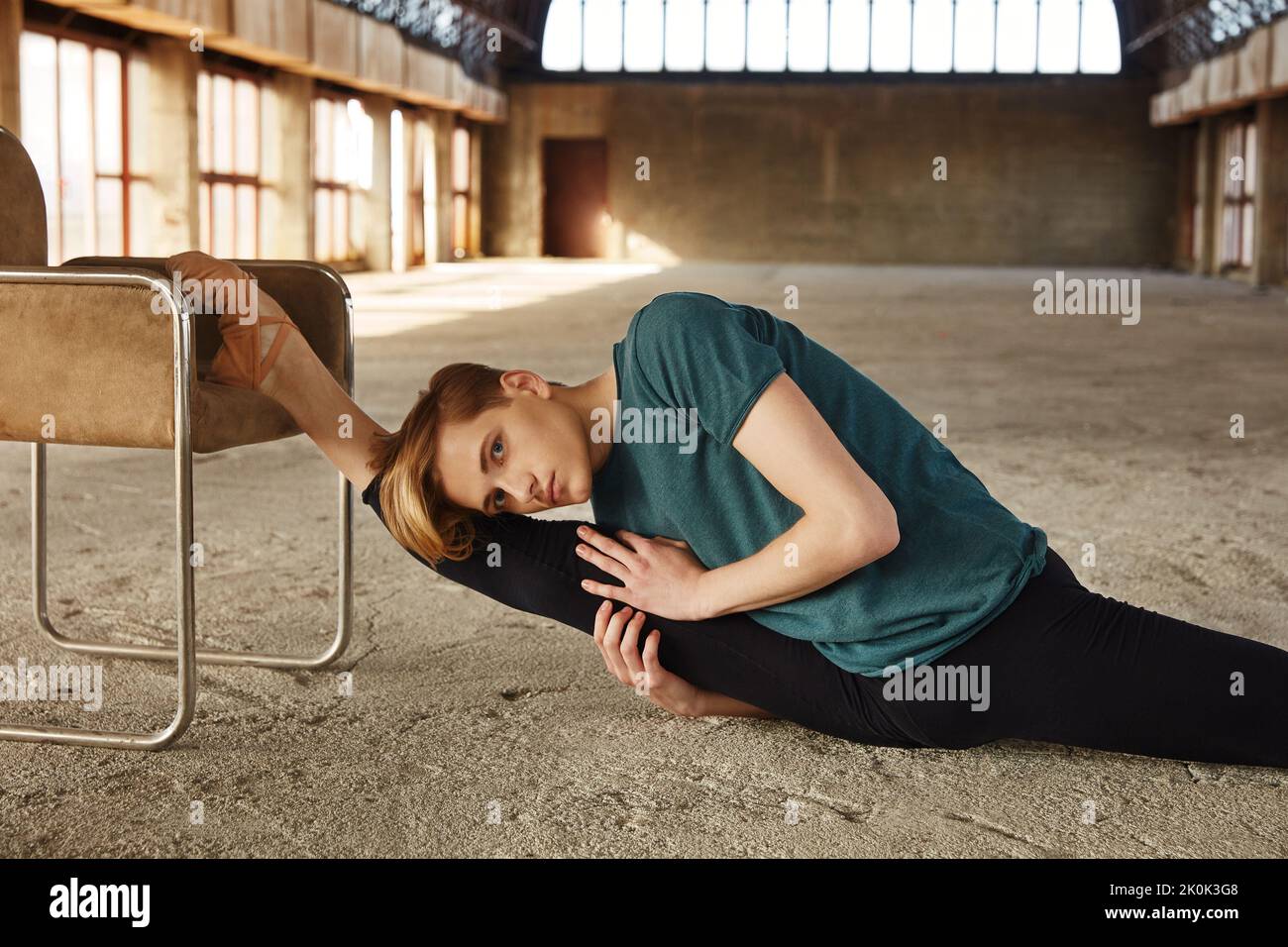 Graceful handsome young ballet dancer in black leotard performing ...