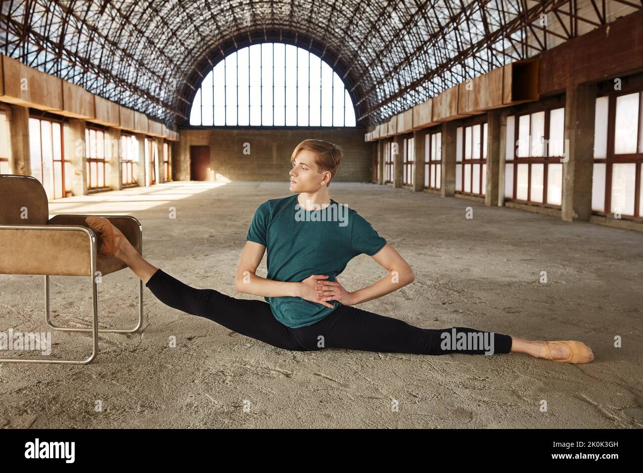 Graceful handsome young ballet dancer in black leotard performing ...