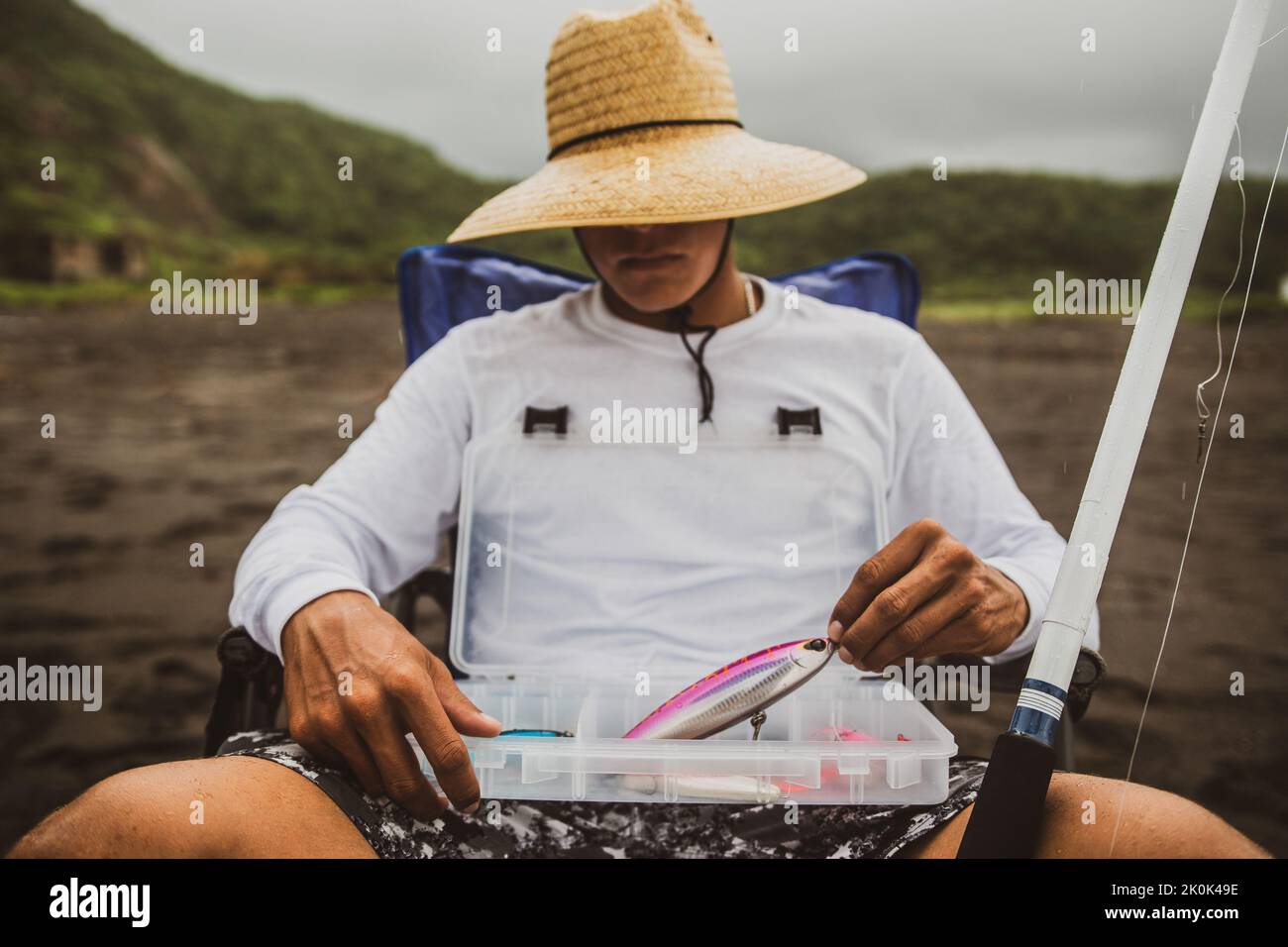 Crop anonymous male with plastic container filled with special ...