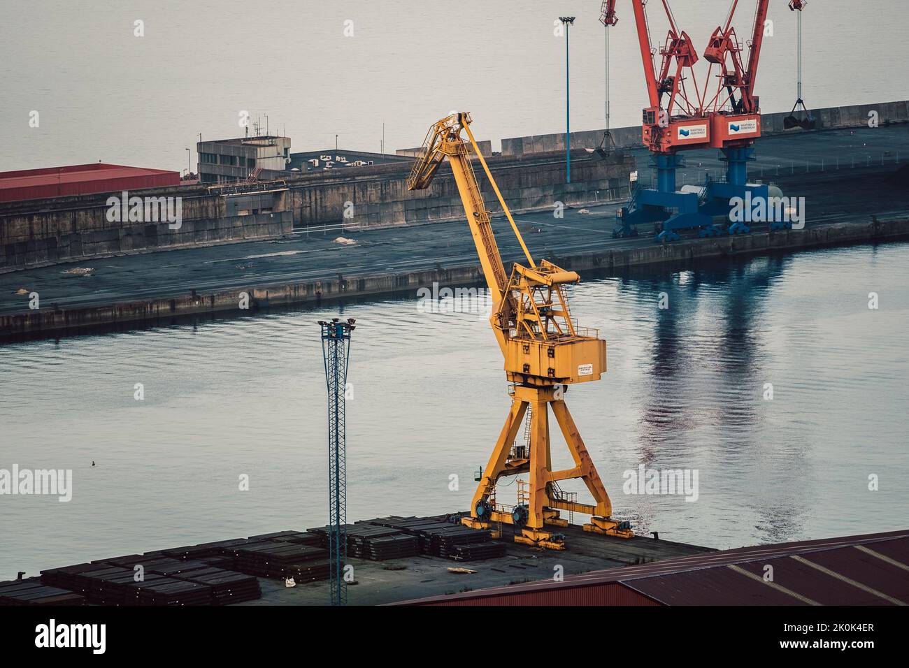 Aerial view of industrial coal extraction with working machines and ...