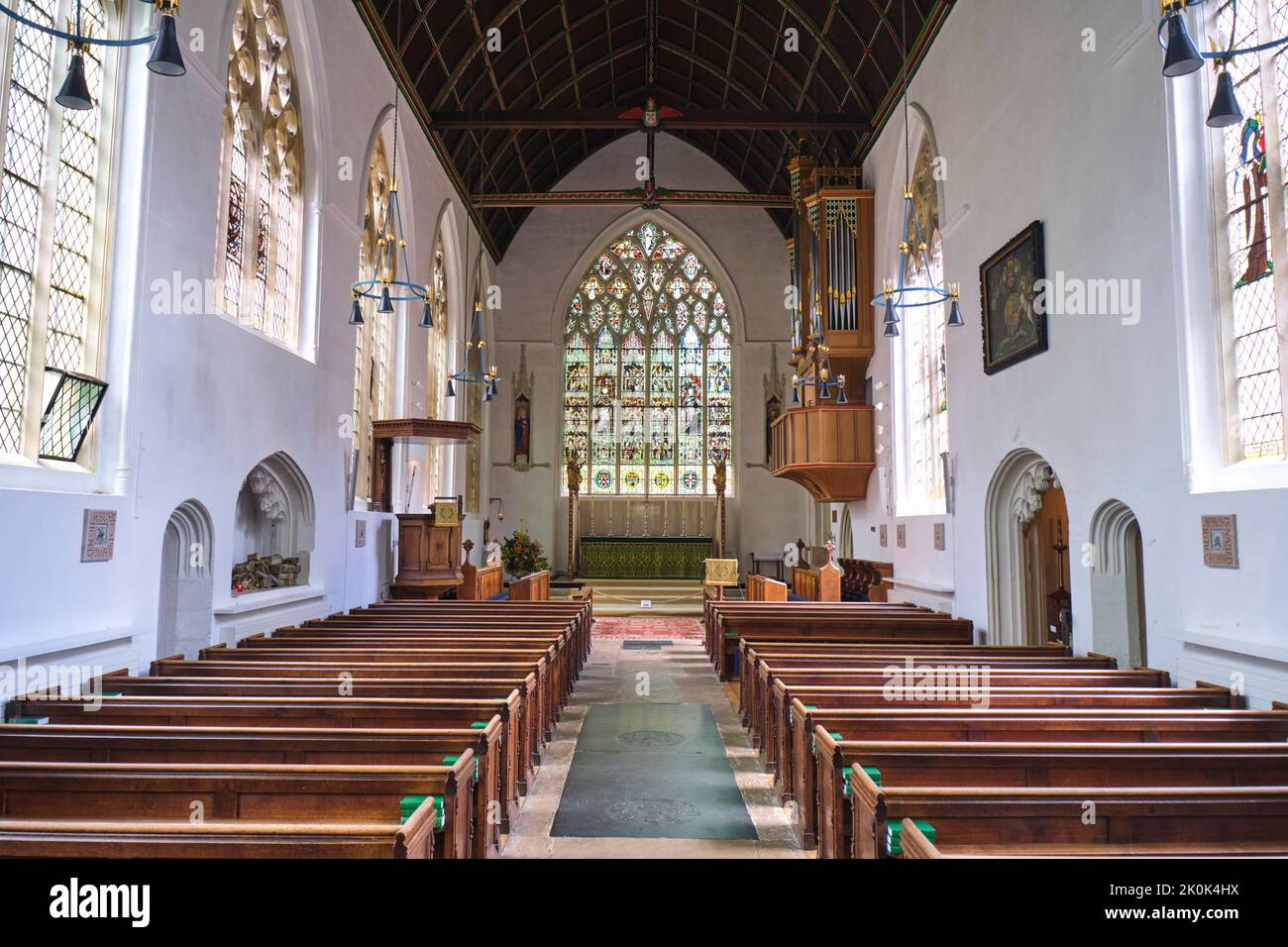 A view of the central nave with whitewashed walls, organ and stained glass. Inside the Little St ...