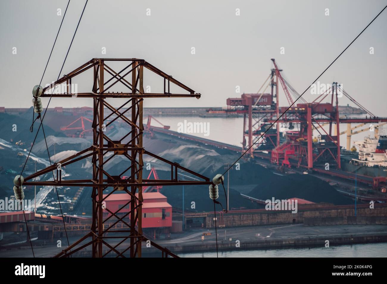Aerial view of industrial coal extraction with working machines and ...
