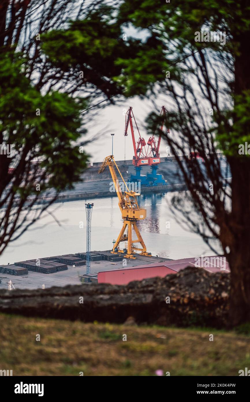 Aerial view of industrial coal extraction with working machines and ...