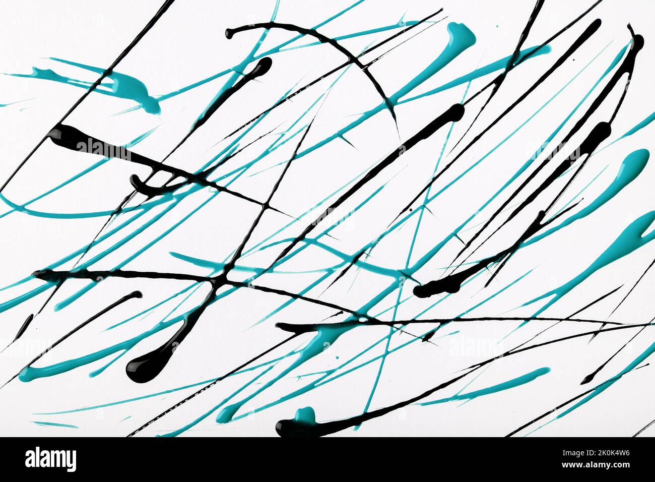 Thin turquoise and black lines and splashes drawn on white background ...