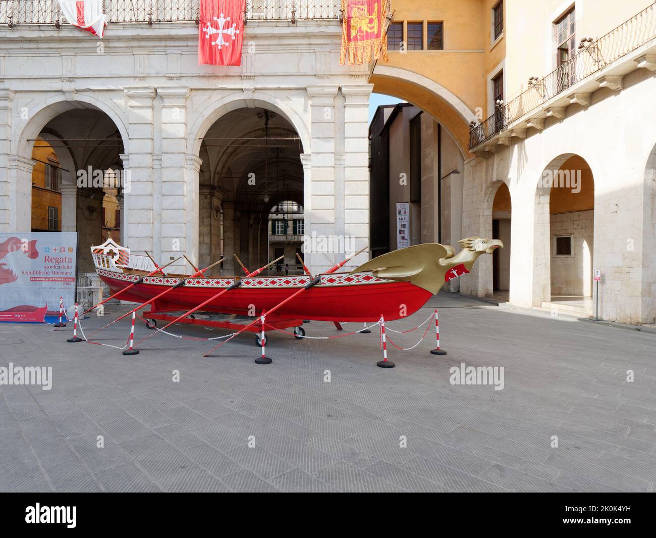 Red traditional wooden rowing boat with an Eagles Head in the town of ...