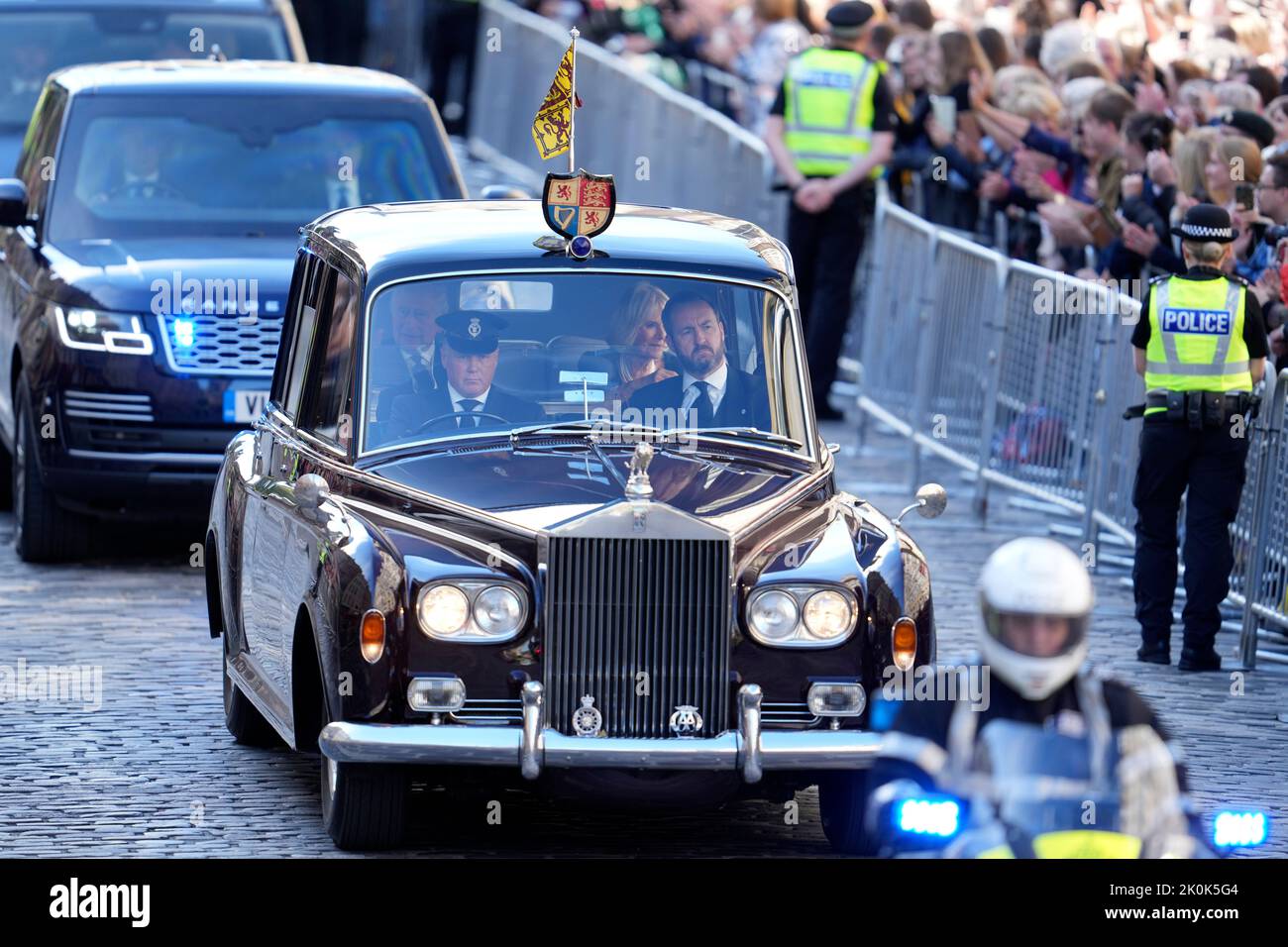 King Charles III and the Queen Consort are driven along the Royal Mile ...