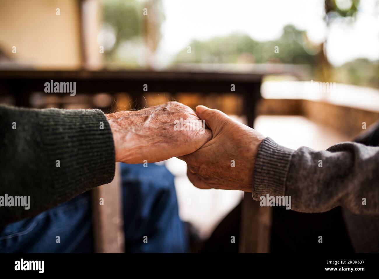 elderly couple shaking hands Stock Photo - Alamy