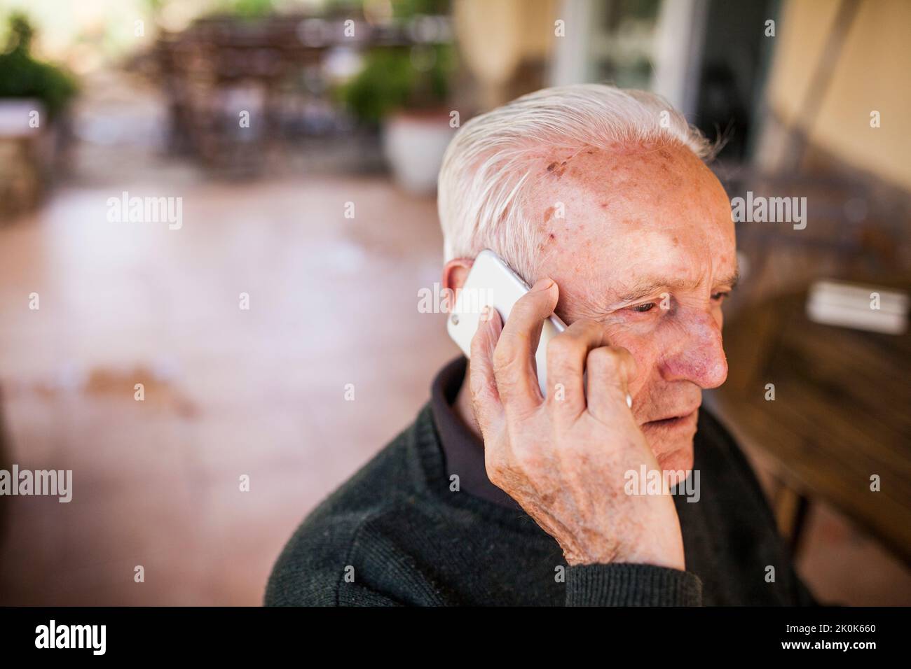 Elderly speaking serious hi-res stock photography and images - Alamy